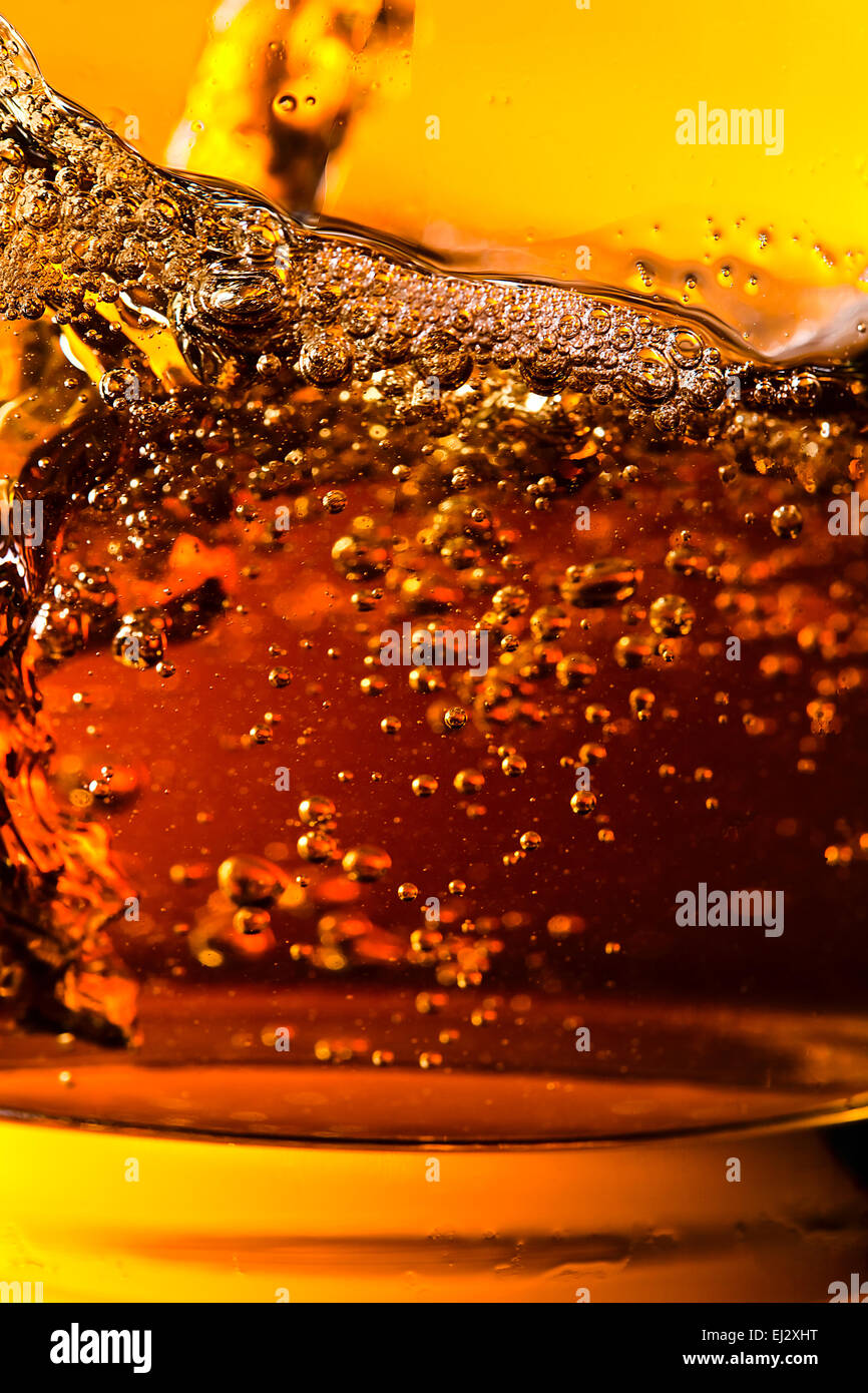 detail of an alcoholic beverage on yellow background Stock Photo - Alamy