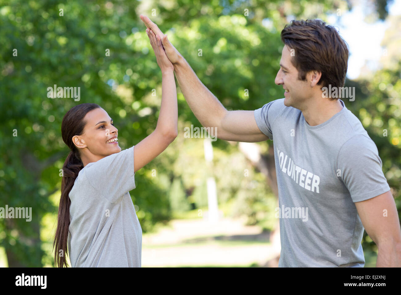 High five volunteer community hi-res stock photography and images - Alamy
