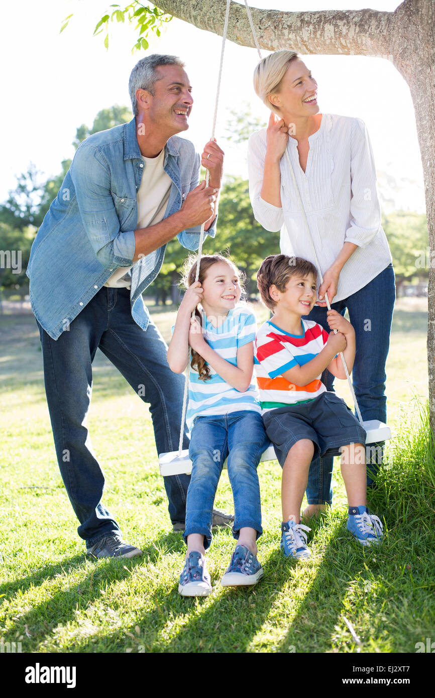 Child and adult and swing and tree hi-res stock photography and images ...