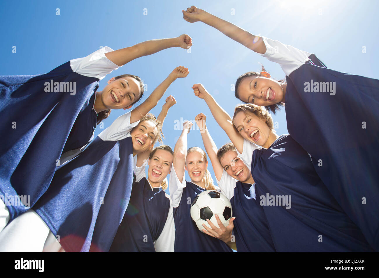 Pretty football players smiling at camera Stock Photo - Alamy