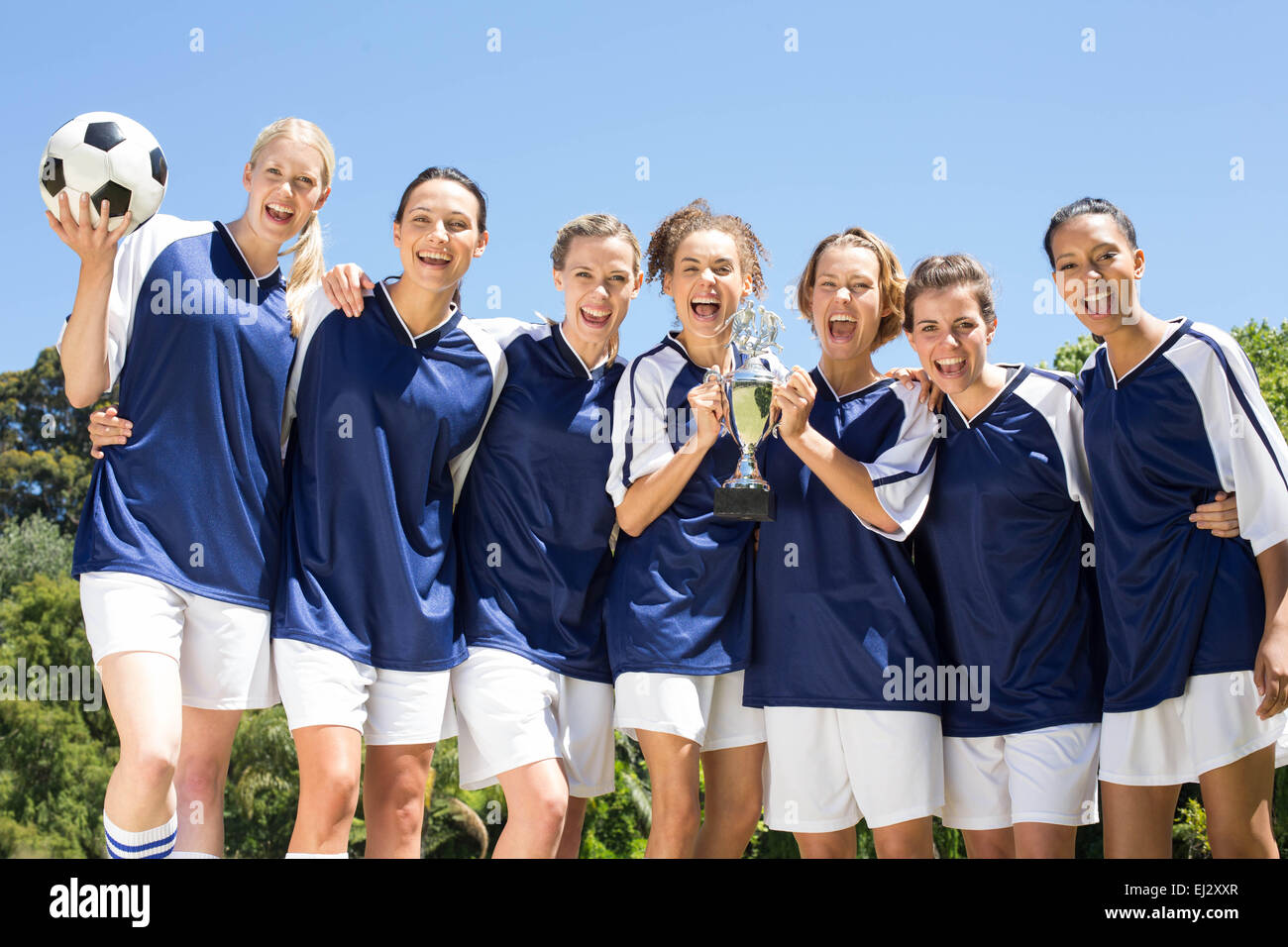 Pretty football players celebrating their win Stock Photo - Alamy