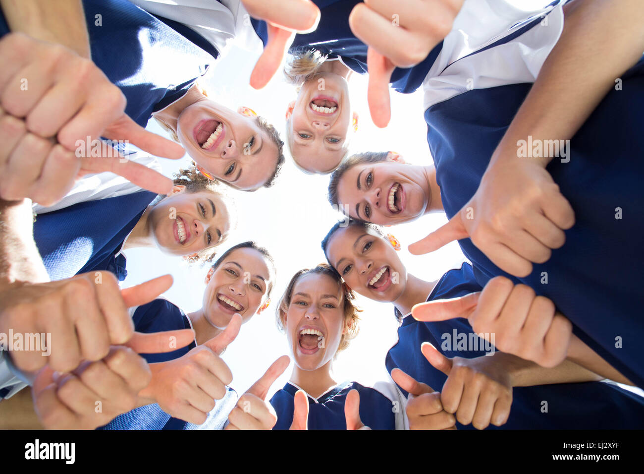 Pretty football players smiling at camera Stock Photo - Alamy