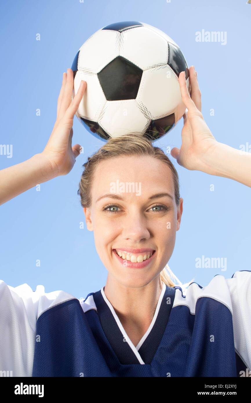 Pretty football player smiling at camera Stock Photo - Alamy