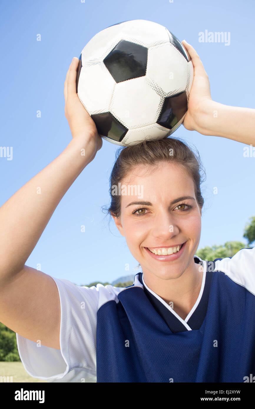 Pretty football player smiling at camera Stock Photo - Alamy
