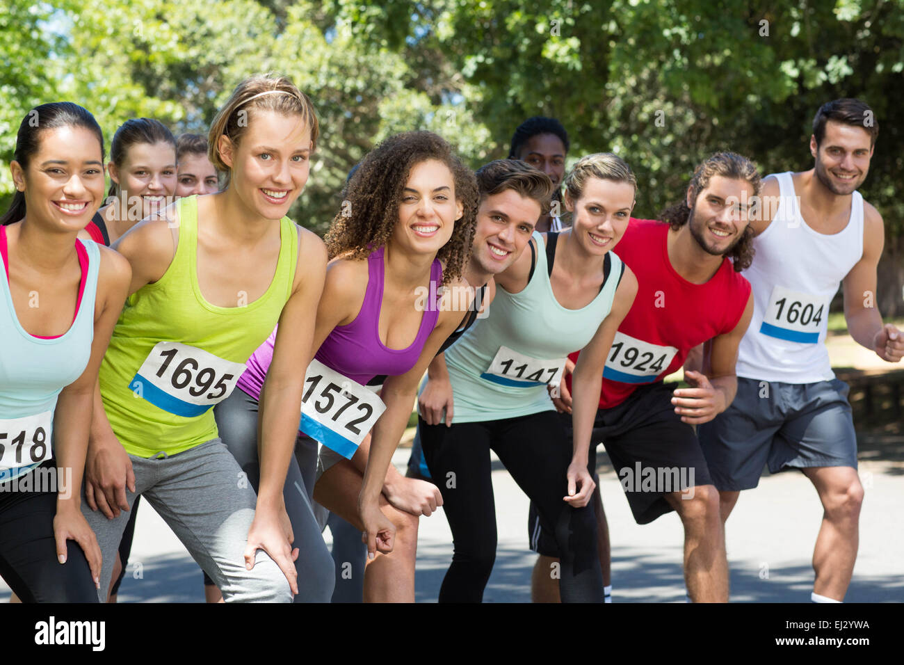 Fit people running race in park Stock Photo - Alamy