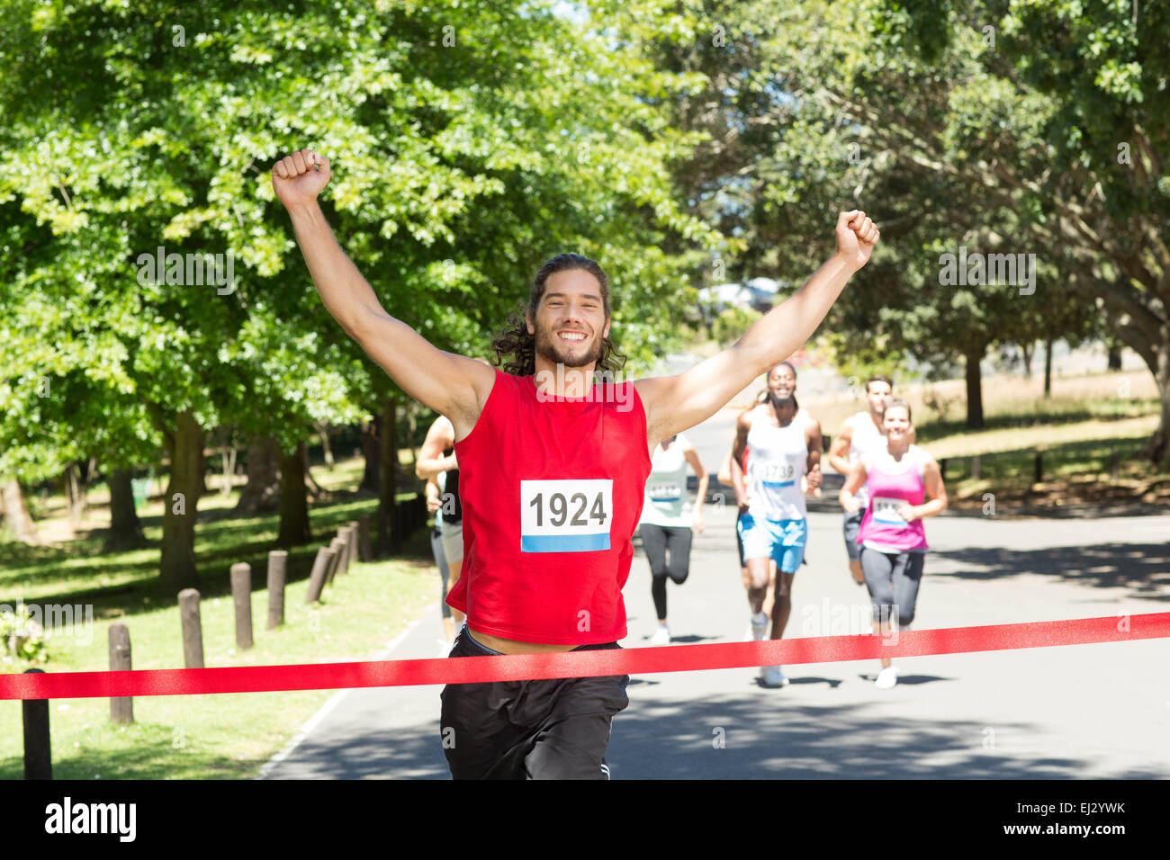 Fit people running race in park Stock Photo - Alamy