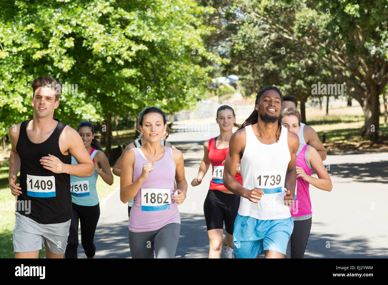 Fit people running race in park Stock Photo - Alamy