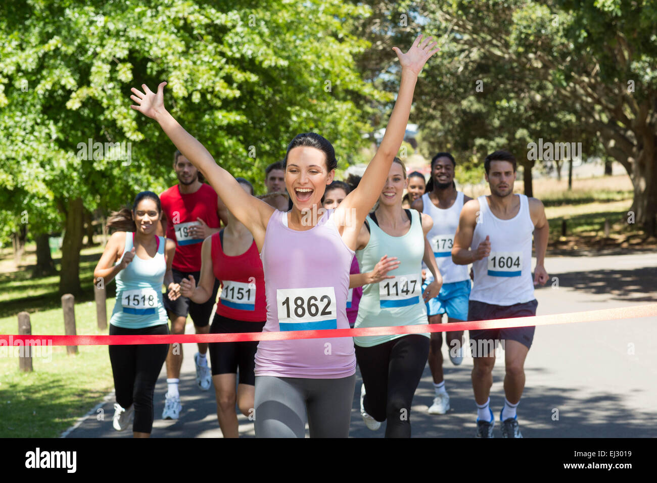 Fit people running race in park Stock Photo - Alamy