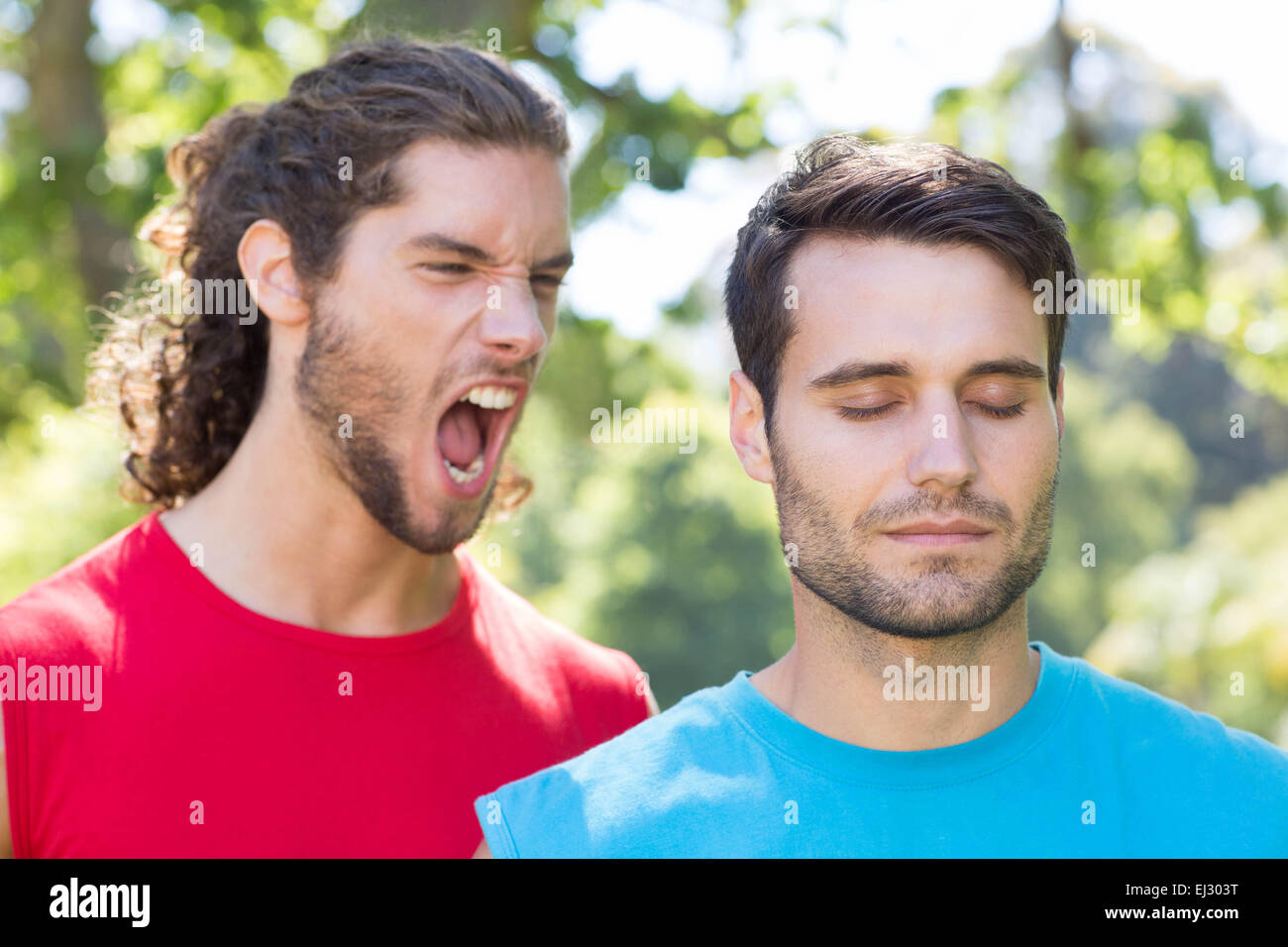 Boot camp fitness trainer yelling during squat exercises Stock Photo ...