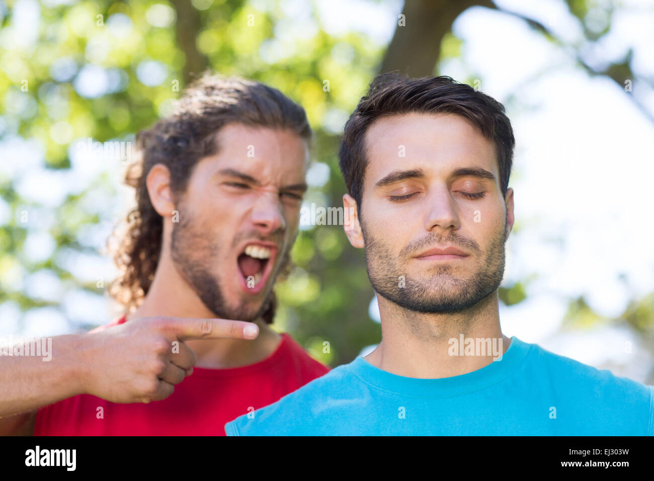 Boot camp fitness trainer yelling during squat exercises Stock Photo ...