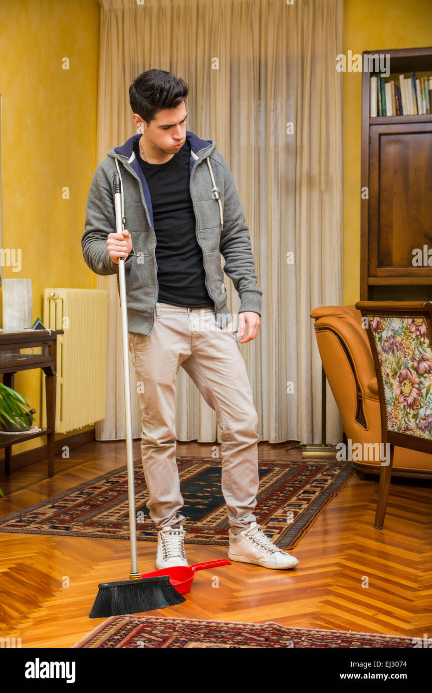 Person holding a broom hi-res stock photography and images - Alamy