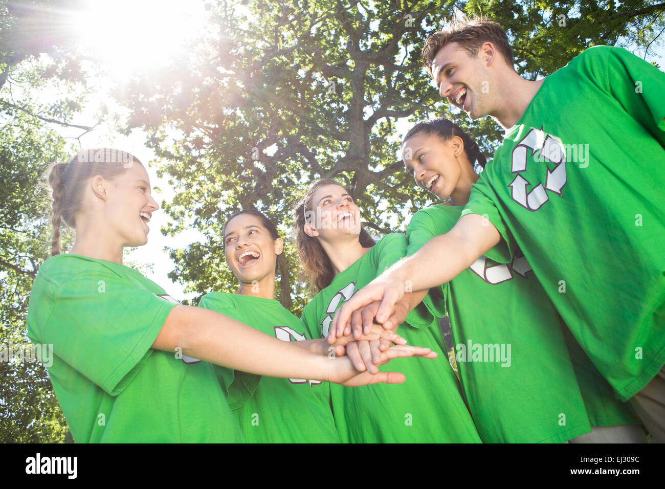 Happy environmental activists in the park Stock Photo - Alamy