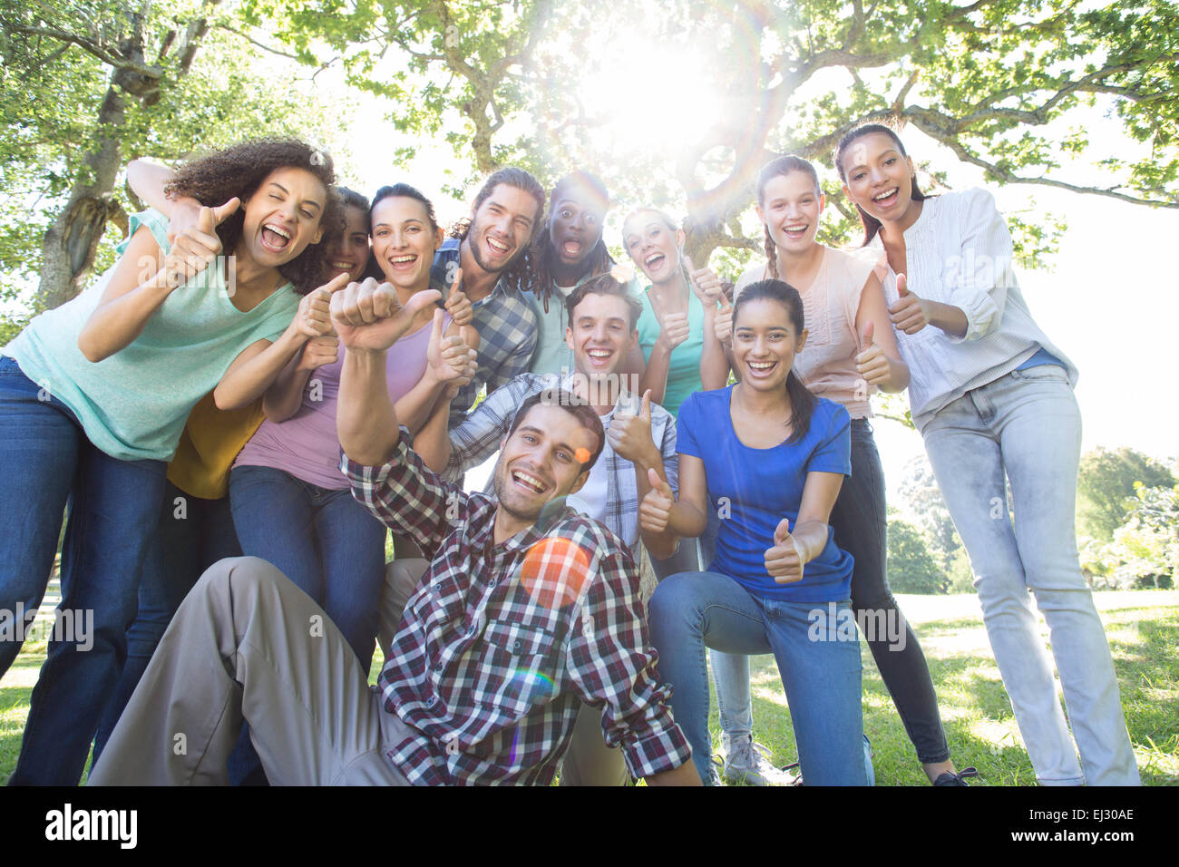 Happy friends in the park Stock Photo - Alamy