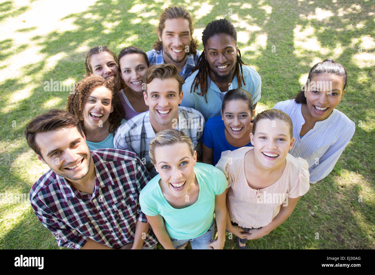 Happy friends in the park Stock Photo - Alamy