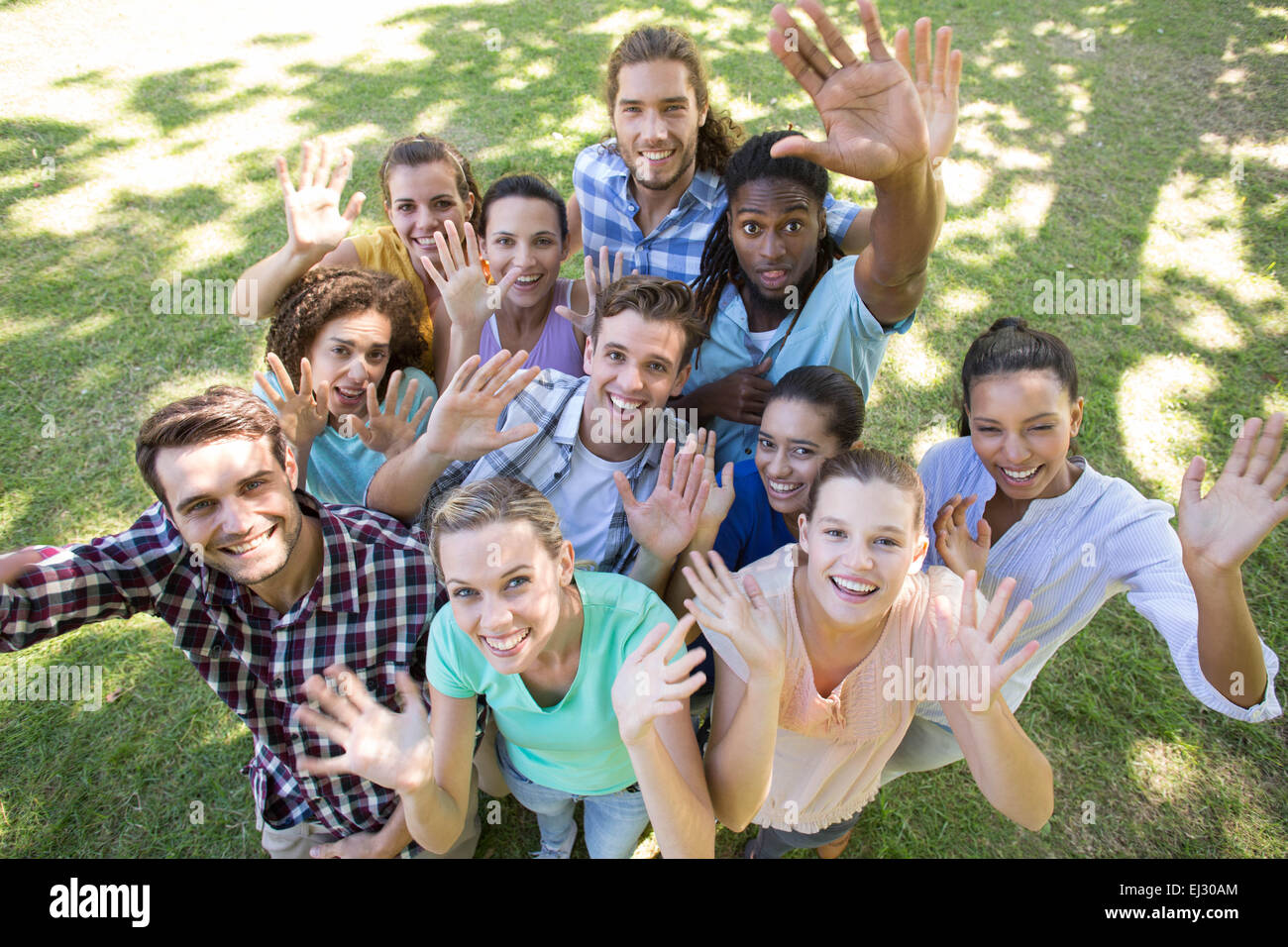 Happy friends in the park Stock Photo - Alamy