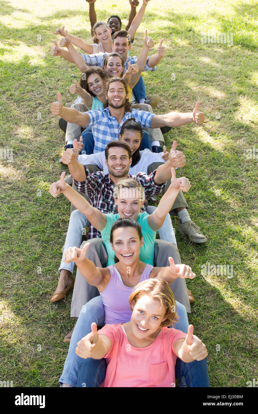 Happy friends in the park playing games Stock Photo - Alamy