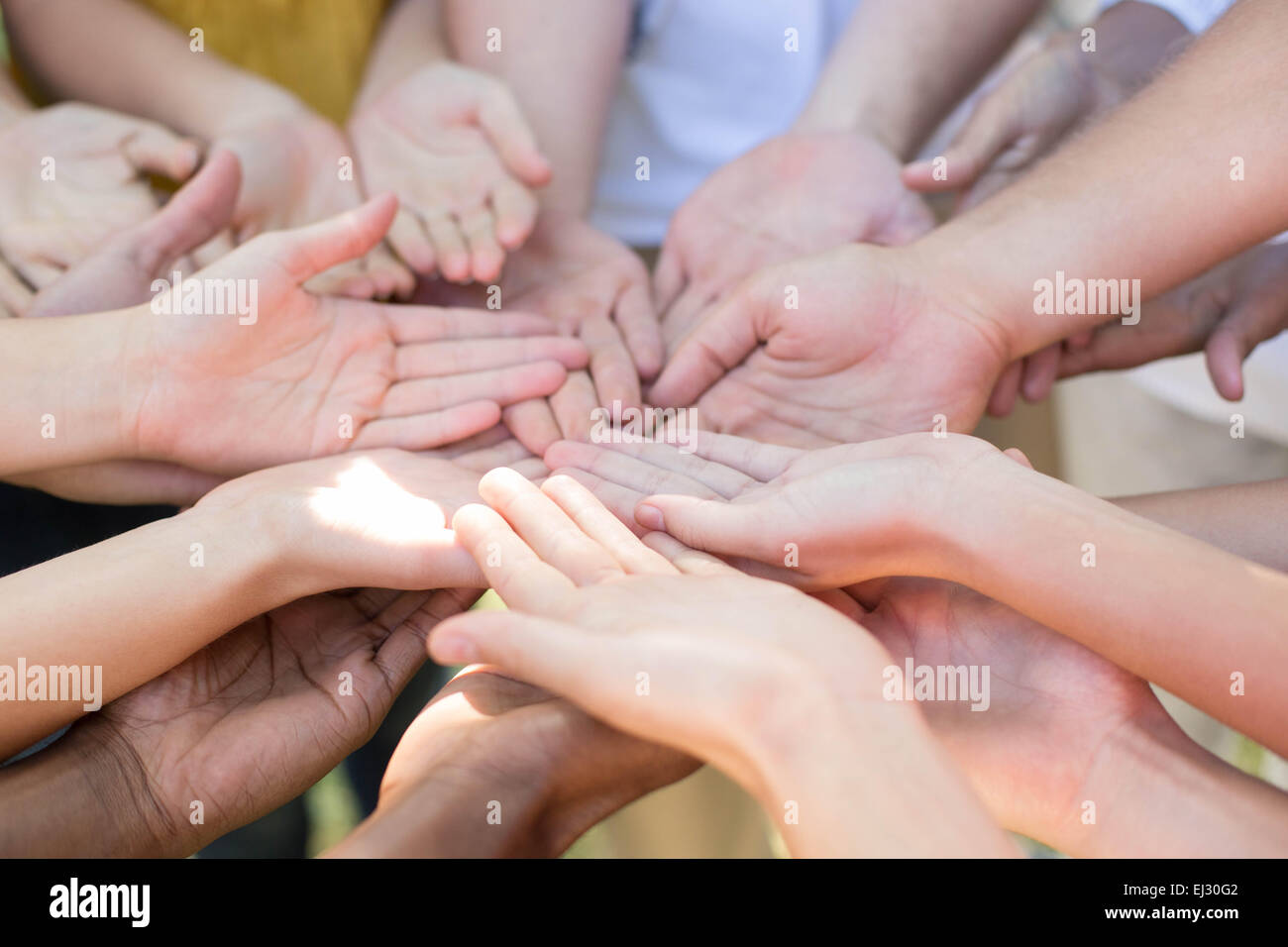 Friends putting their hands together Stock Photo - Alamy