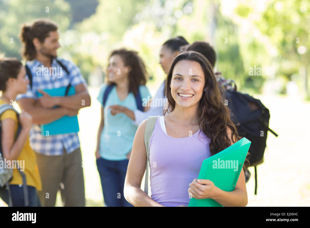 Smiling students on college campus Stock Photo - Alamy