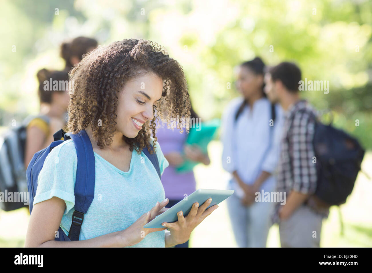 Smiling students on college campus Stock Photo - Alamy