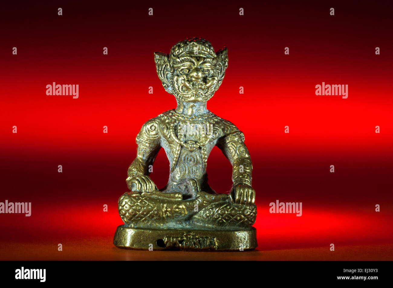 Brass amulet of monkey god, Lord Hanuman, from Thailand in studio ...