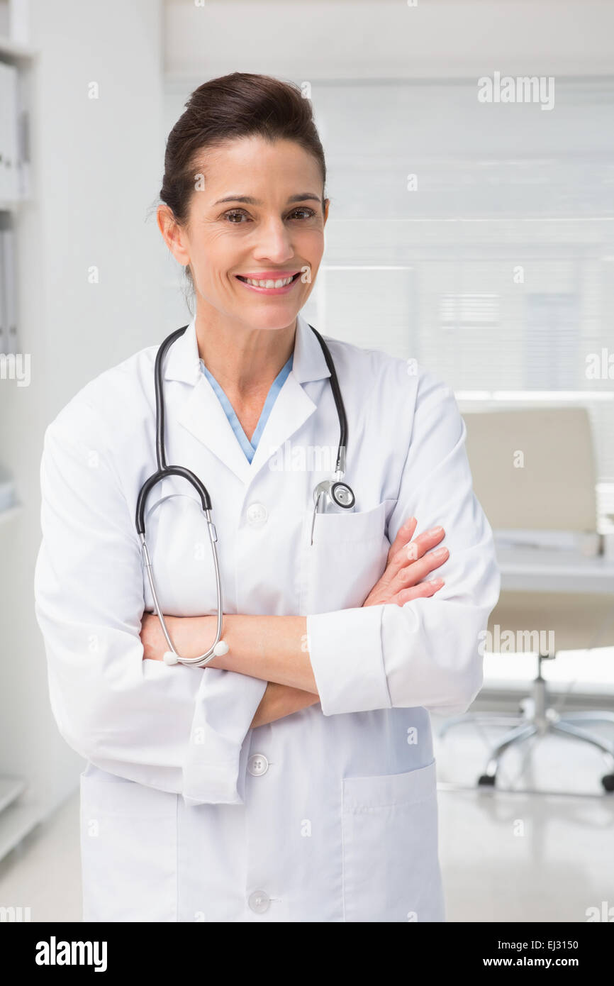 Smiling veterinarian looking at camera Stock Photo - Alamy