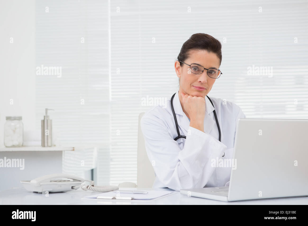 Doctor using laptop Stock Photo - Alamy