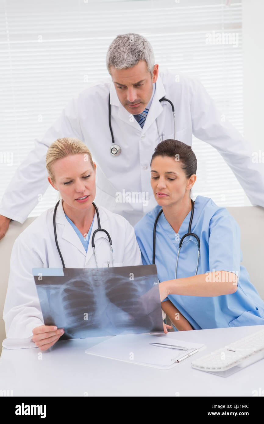 Doctors looking at scans Stock Photo - Alamy