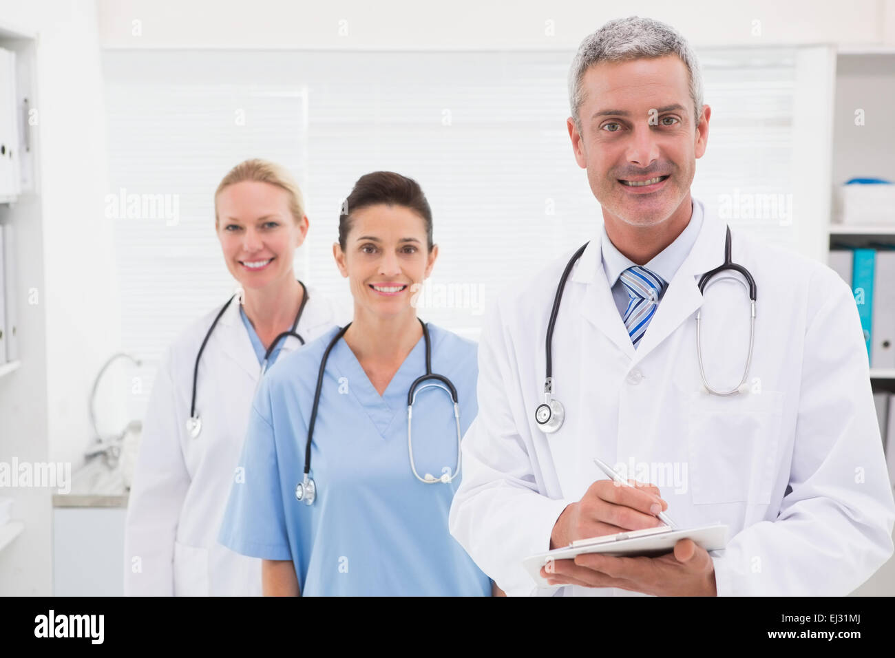 Doctors smiling at camera Stock Photo - Alamy