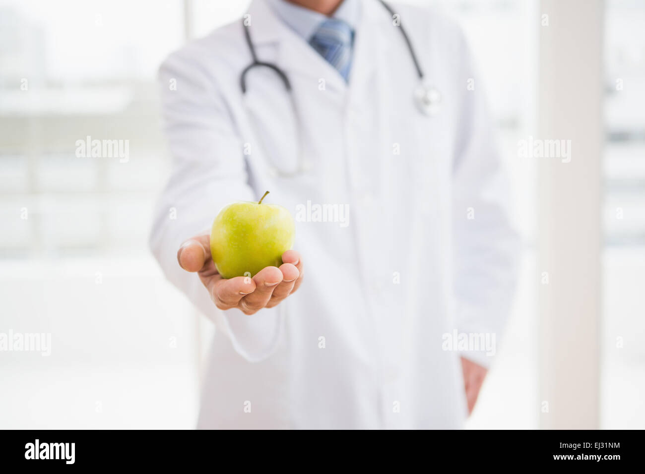 Doctor and apple hi-res stock photography and images - Alamy