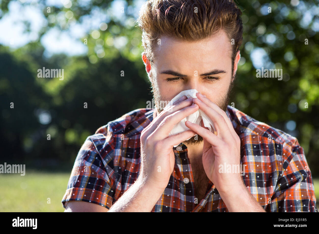 Handsome young man blowing hi-res stock photography and images - Alamy