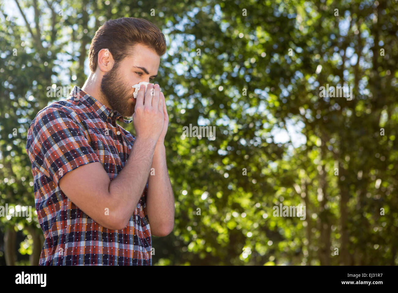 Handsome young man blowing hi-res stock photography and images - Alamy
