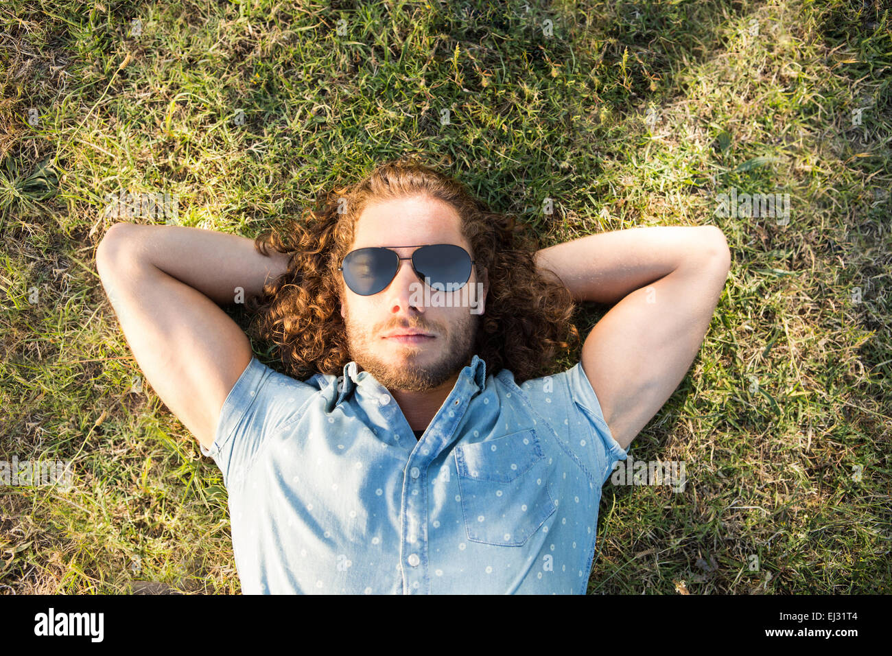 Man lying down hi-res stock photography and images - Alamy