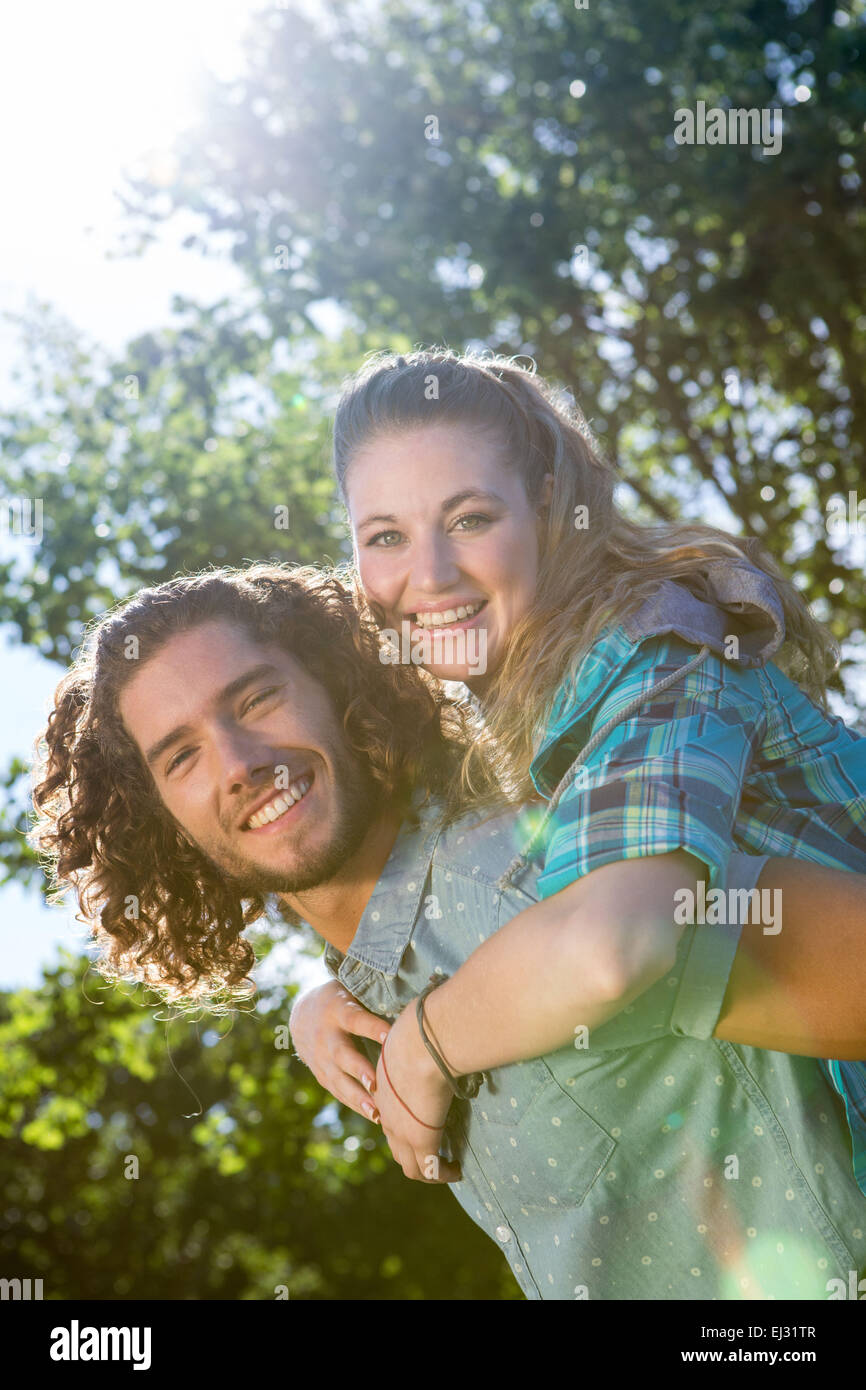 Cute couple having fun in park Stock Photo - Alamy