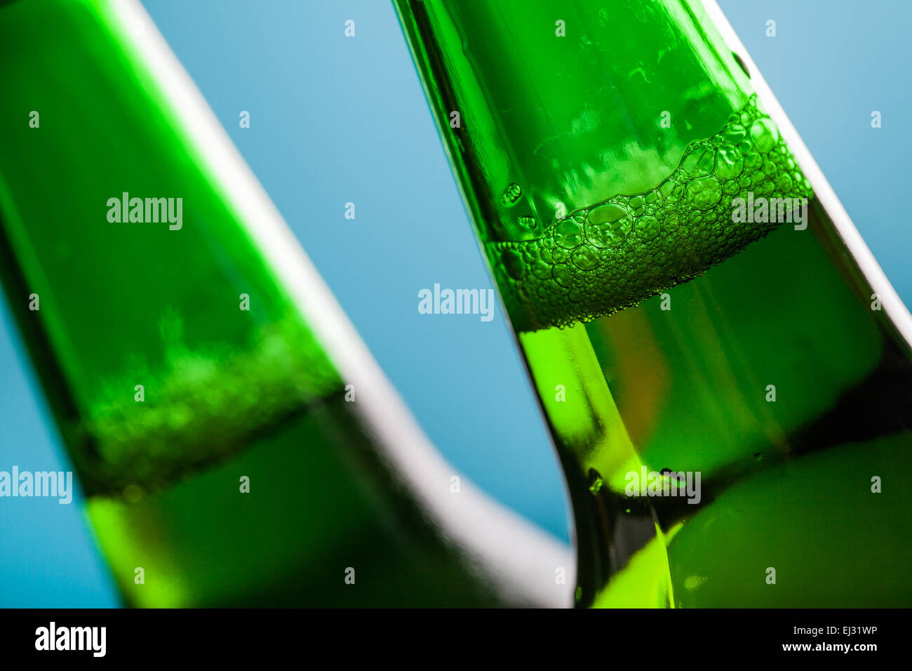 lager beer in glass bottle close-up on a blue background Stock Photo ...