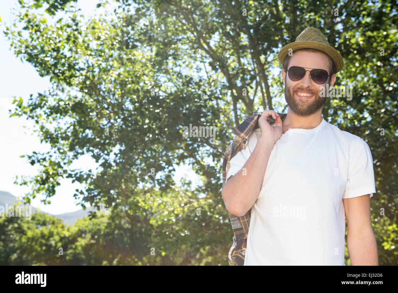 Handsome hipster smiling at camera Stock Photo - Alamy