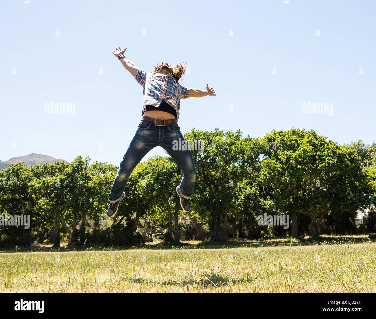 Young man jumping energy hi-res stock photography and images - Alamy