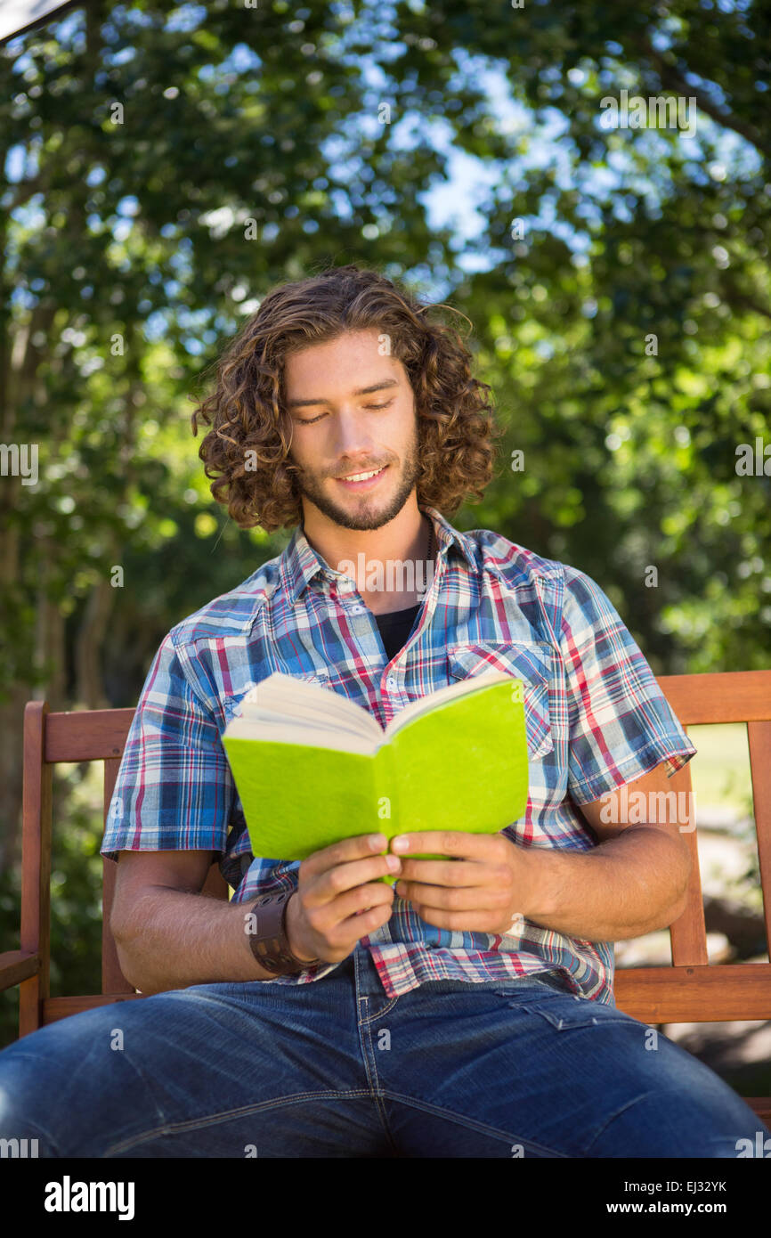 Man curly hair reading book hi-res stock photography and images - Alamy