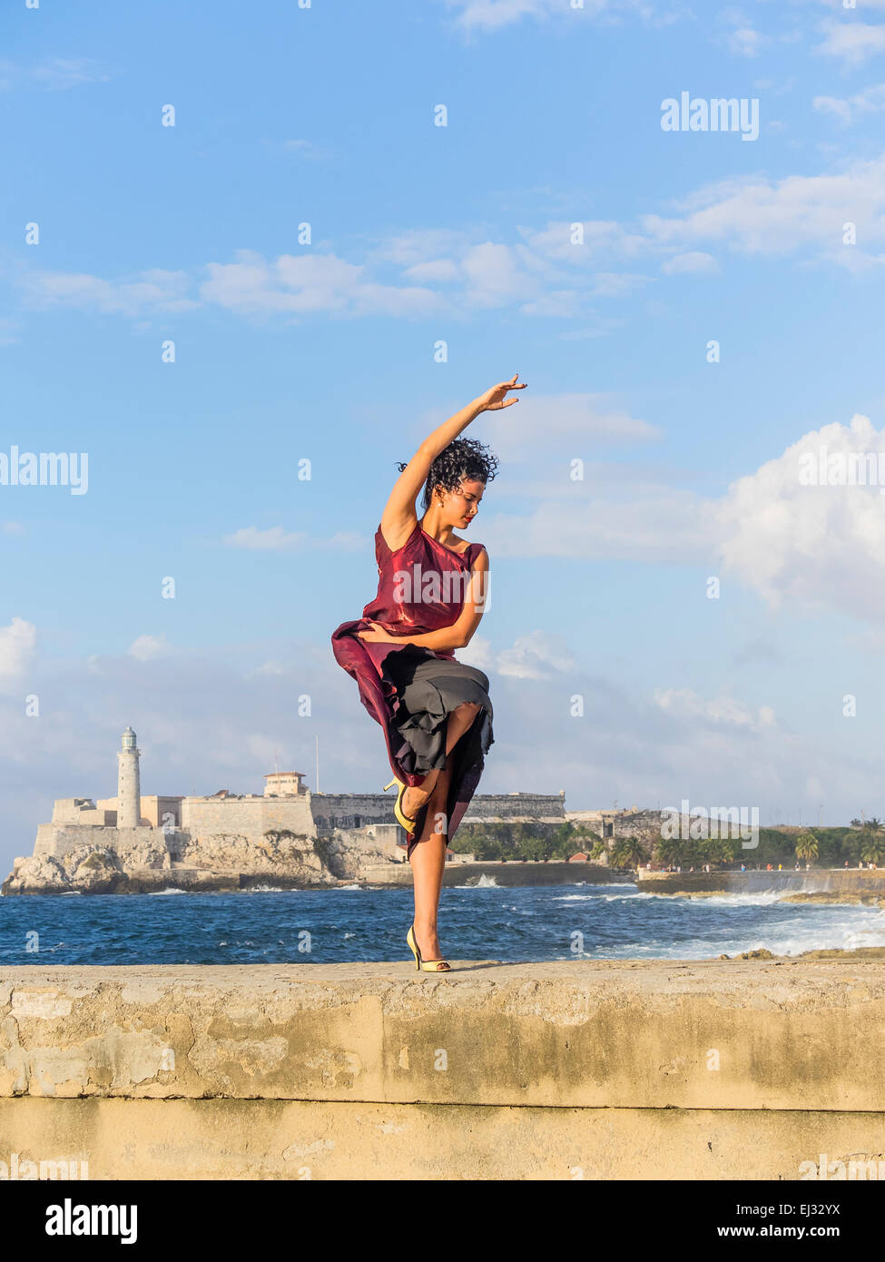 26 year Hispanic Cuban female model posing in maroon dress on the ...