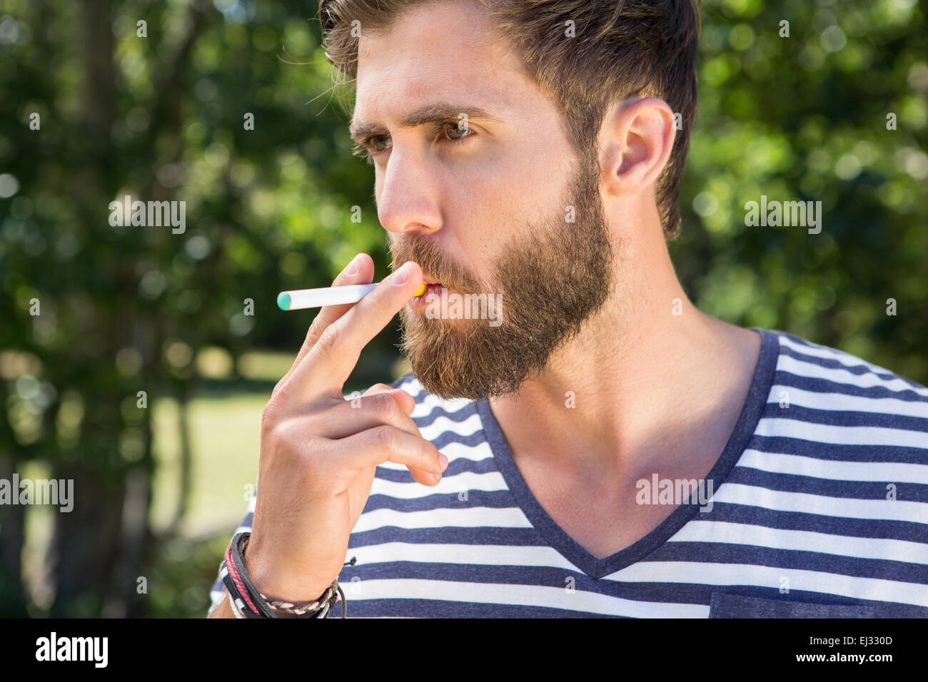 Young man beard vaping electronic hi-res stock photography and images ...