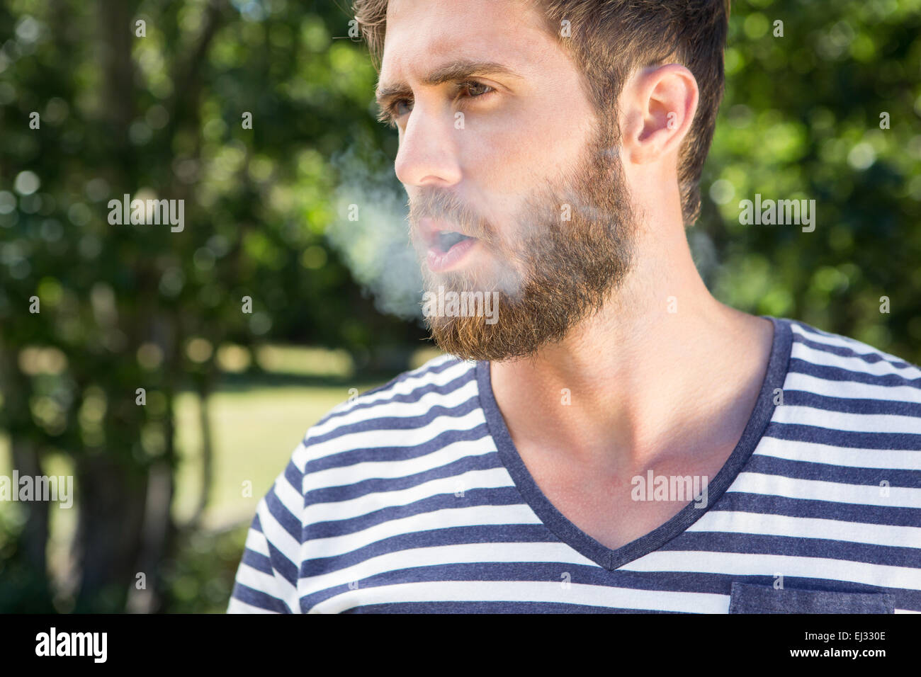 Young man beard vaping electronic hi-res stock photography and images ...