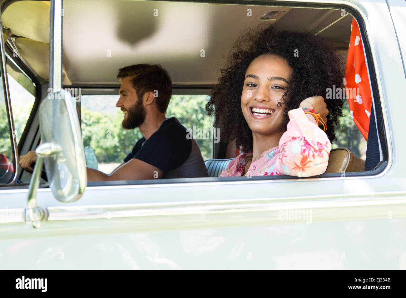 Hipster couple driving in camper van Stock Photo - Alamy