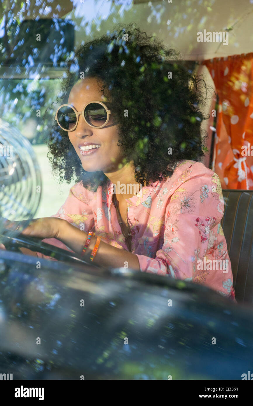 Pretty hipster driving camper van Stock Photo - Alamy