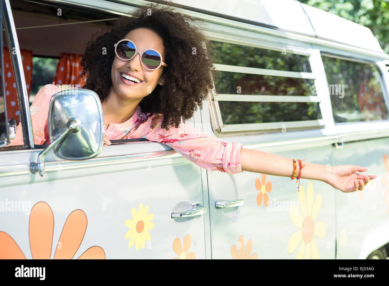 Pretty hipster leaning out van window Stock Photo - Alamy