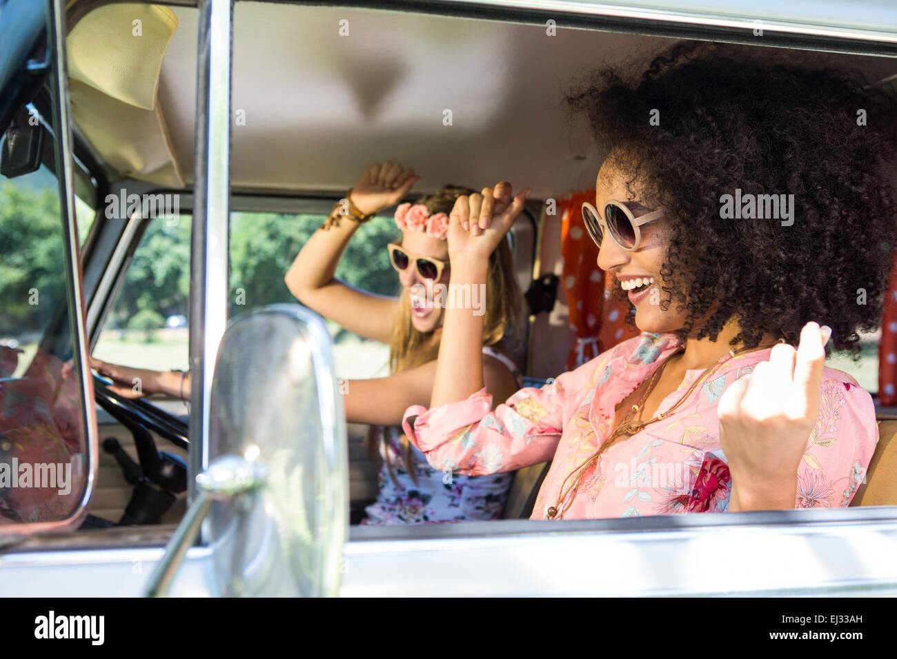 Happy friends on a road trip Stock Photo - Alamy