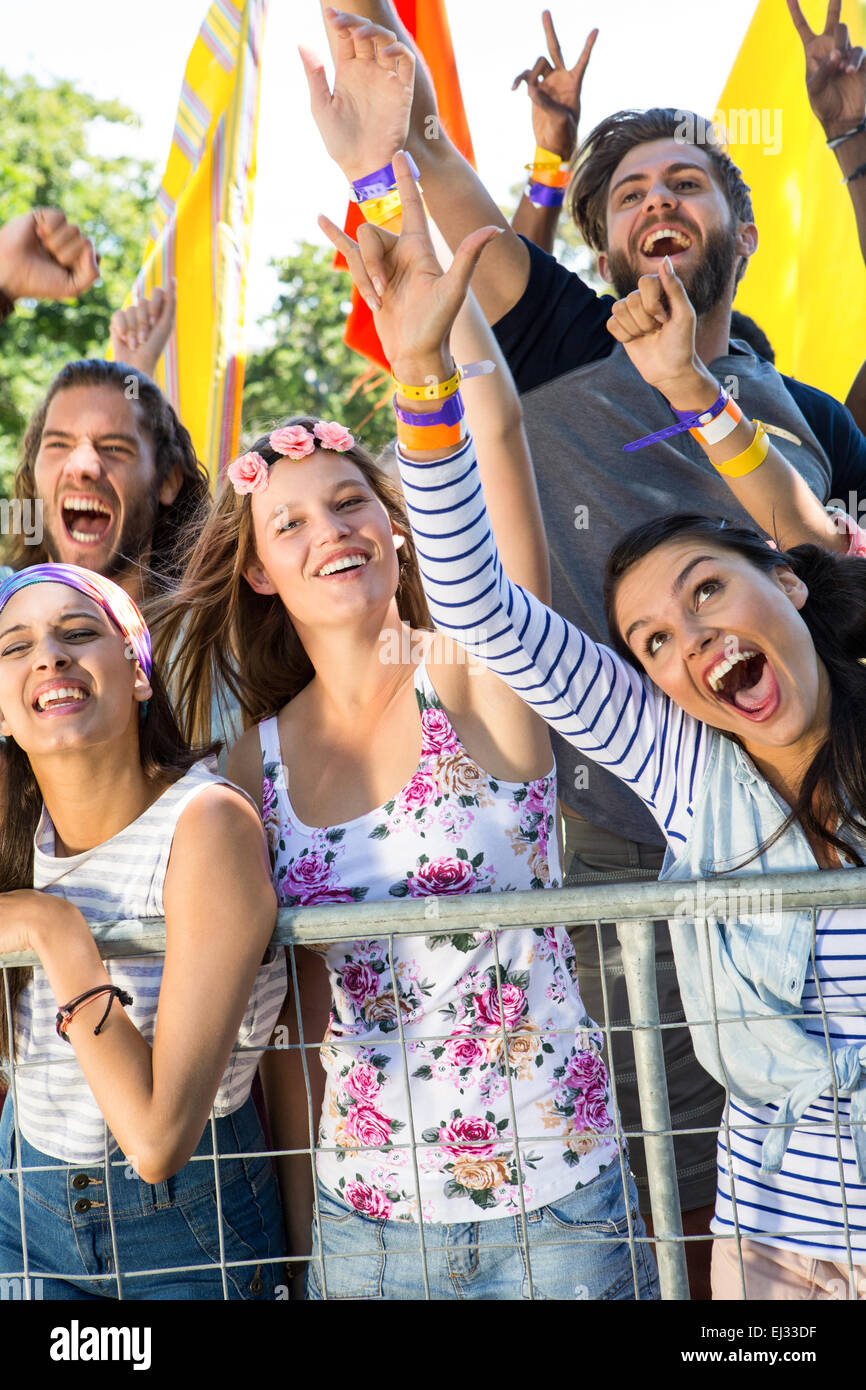 Excited music fans up the front at festival Stock Photo - Alamy