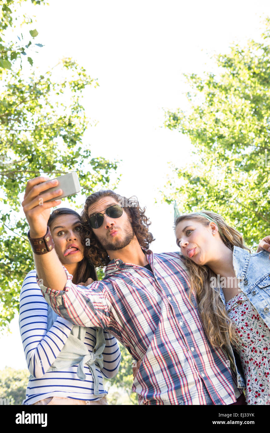 Happy friends taking a selfie Stock Photo - Alamy