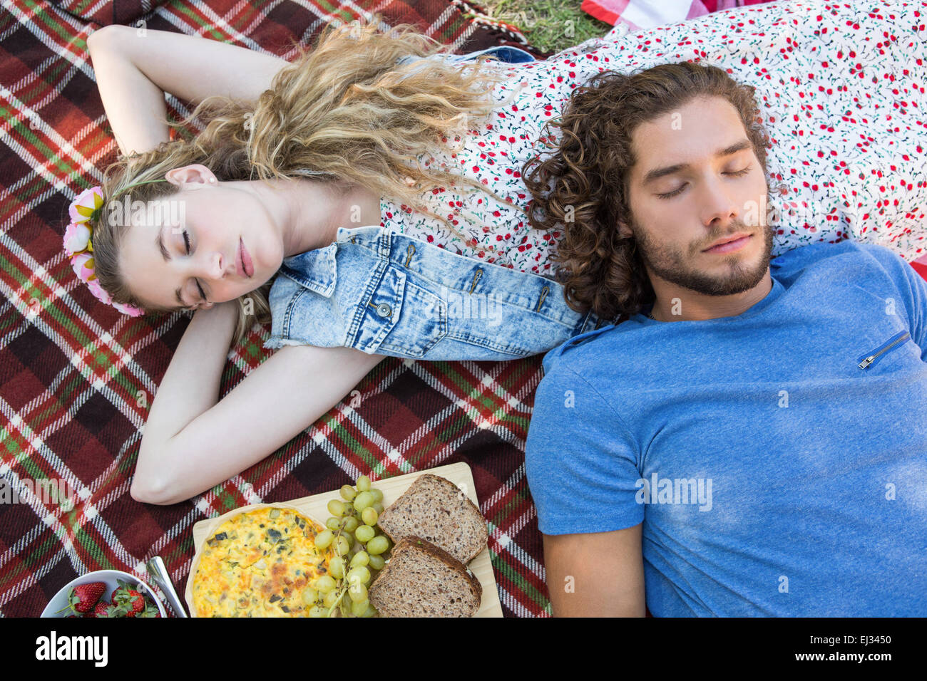Cute couple having a picnic Stock Photo - Alamy