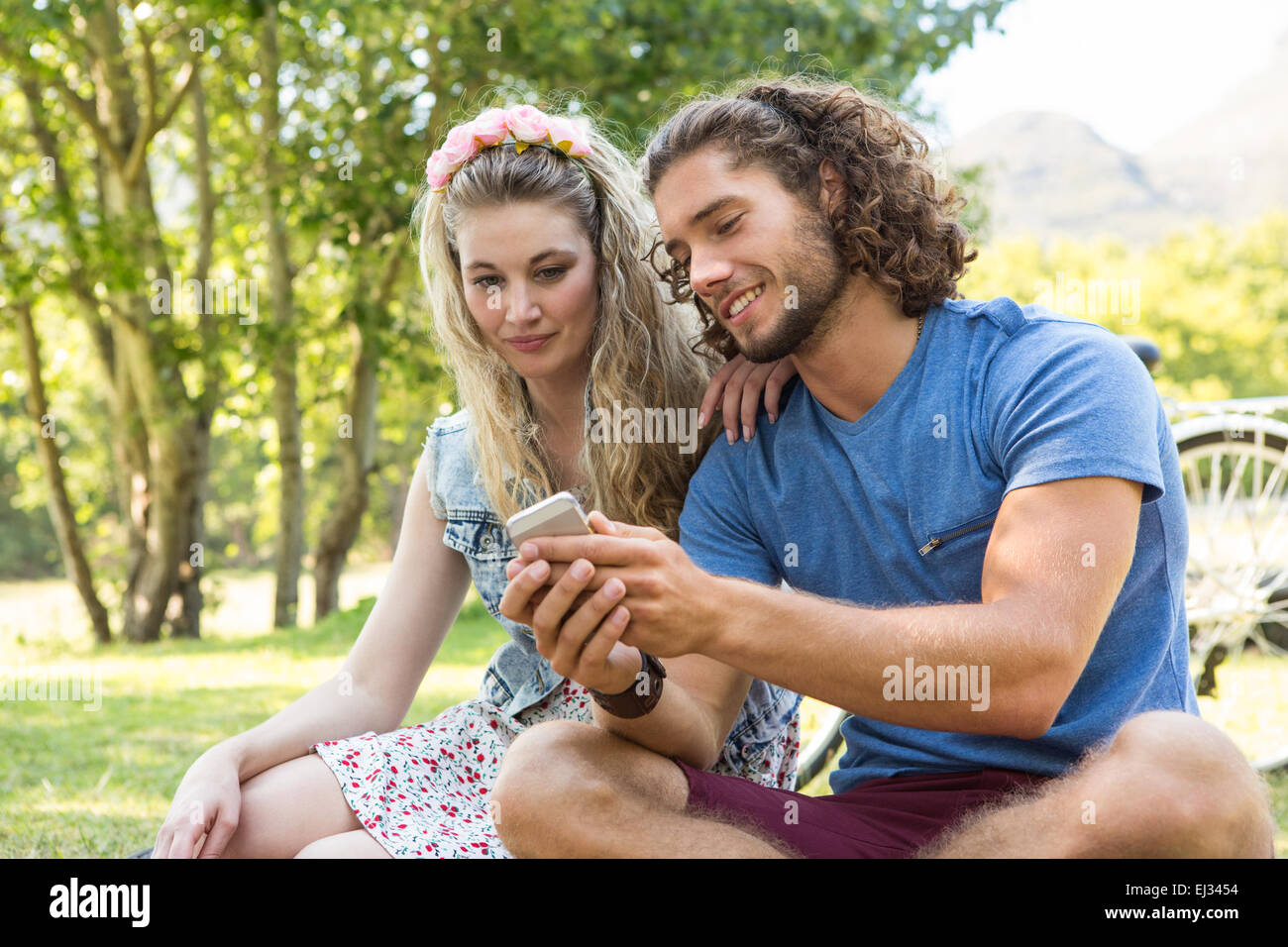Cute couple having a picnic Stock Photo - Alamy