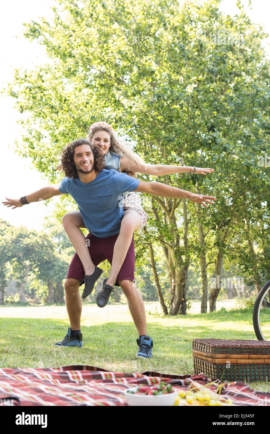 Cute couple having a picnic Stock Photo - Alamy