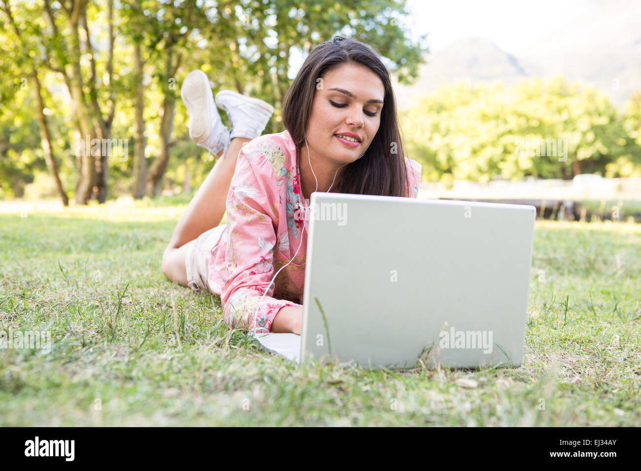 Woman happy park laptop summer hi-res stock photography and images - Alamy